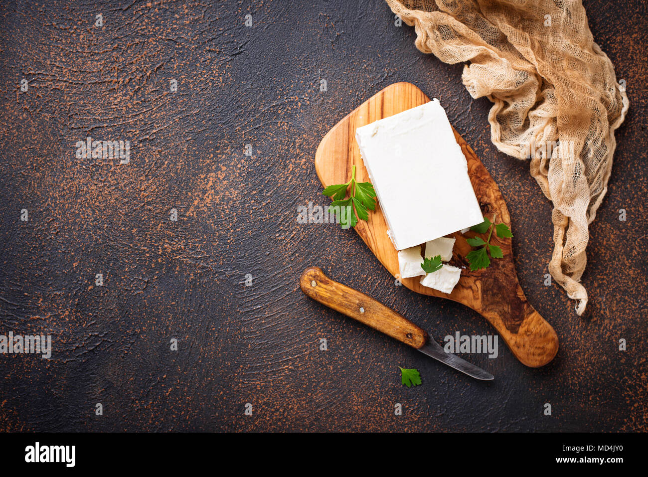 Feta cheese on rusty background Stock Photo - Alamy