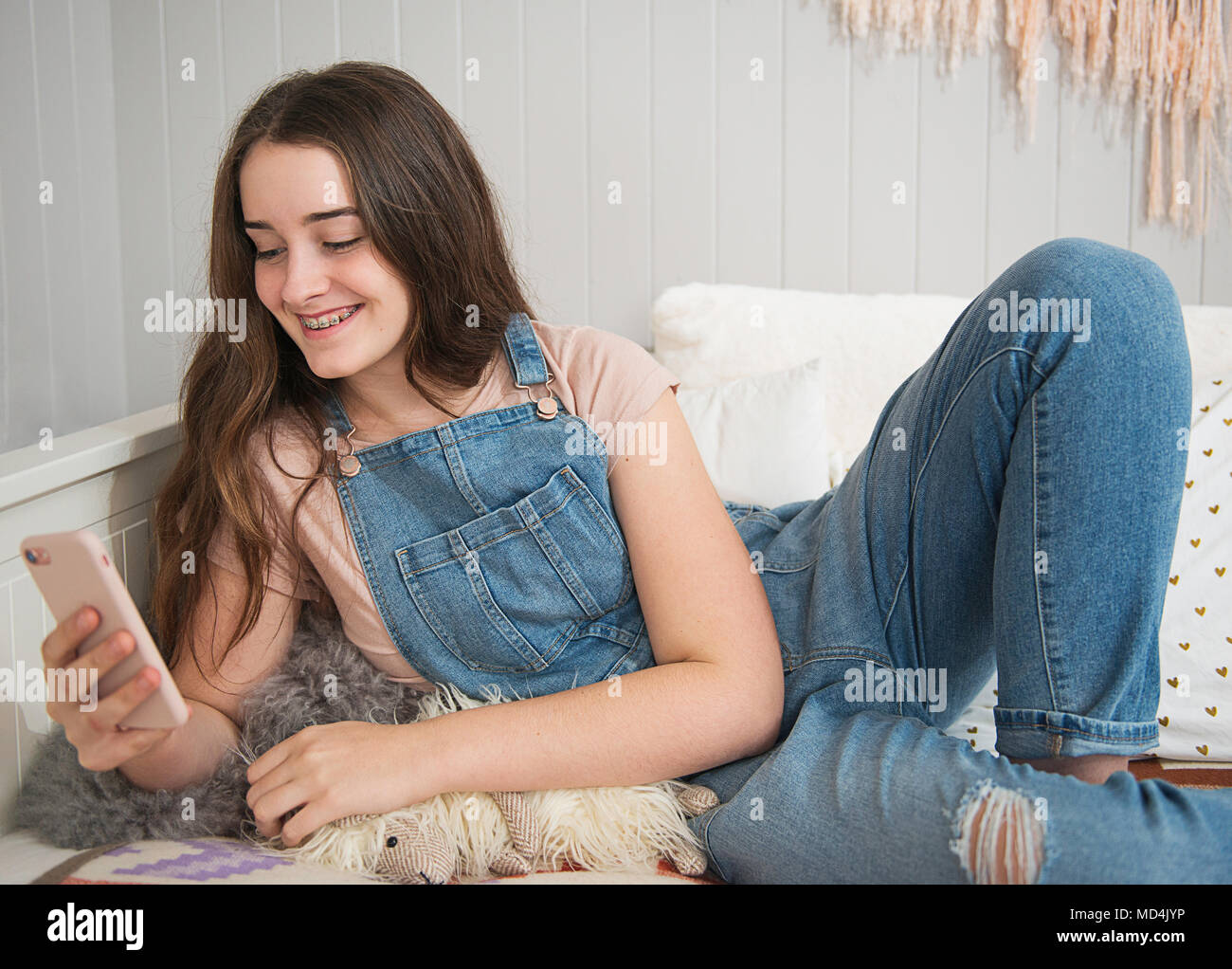 A teenaged girl (13 years old) on facetiming on her cell phone Stock ...