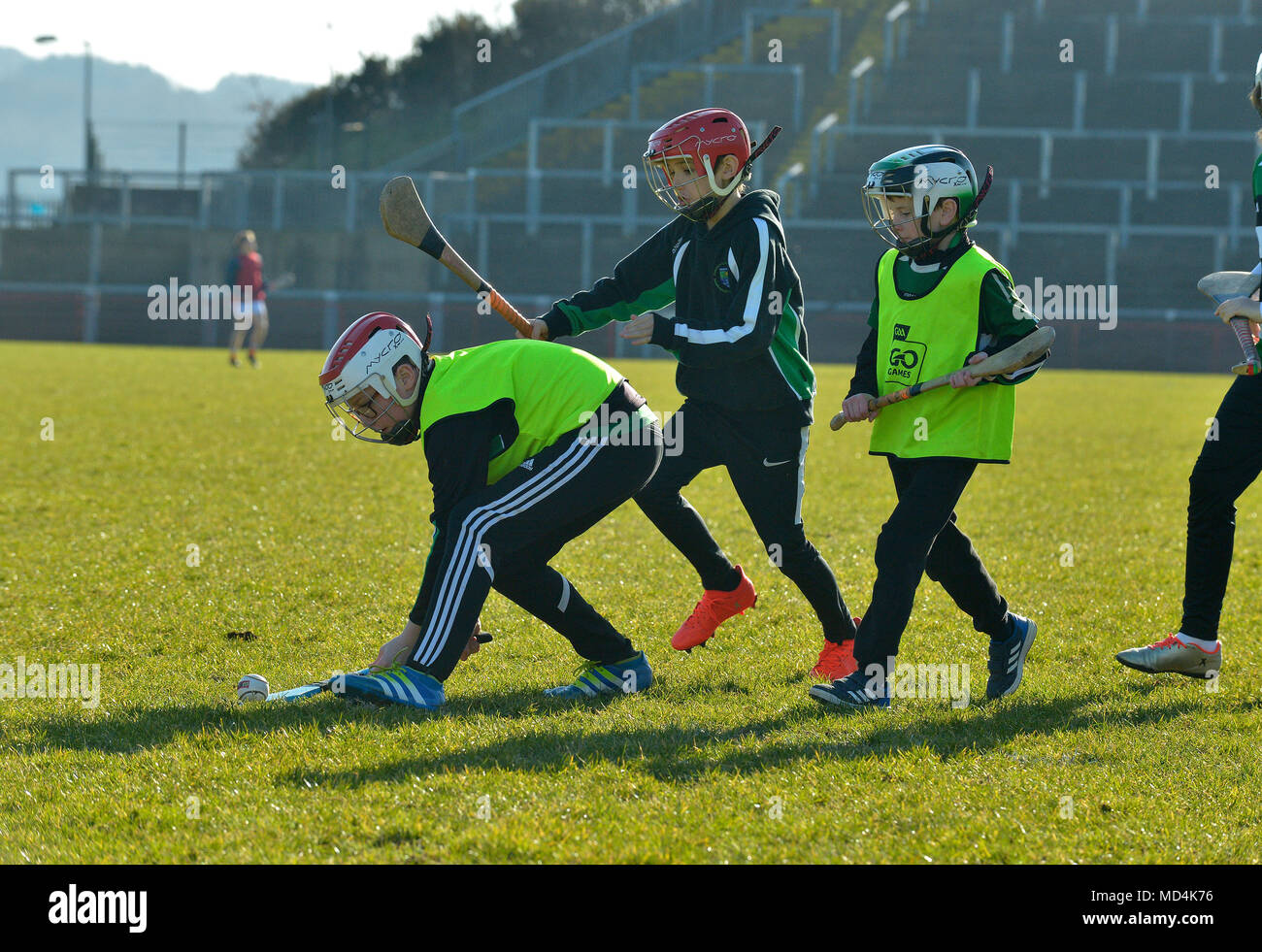 Primary school children playing GAA hurling at Celtic Park, Derry Stock ...
