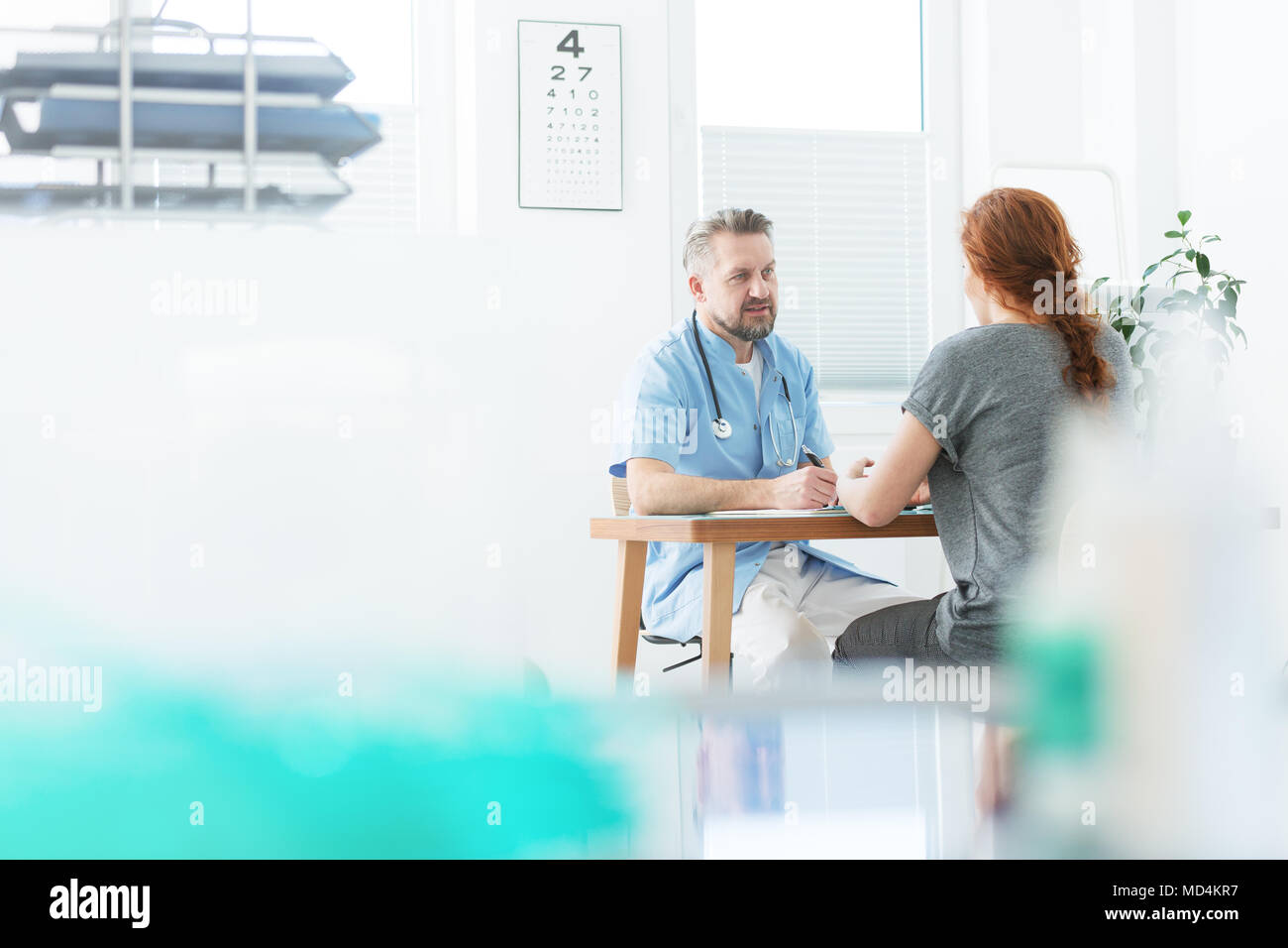 Internist and patient during medical consultation in the doctor's ...