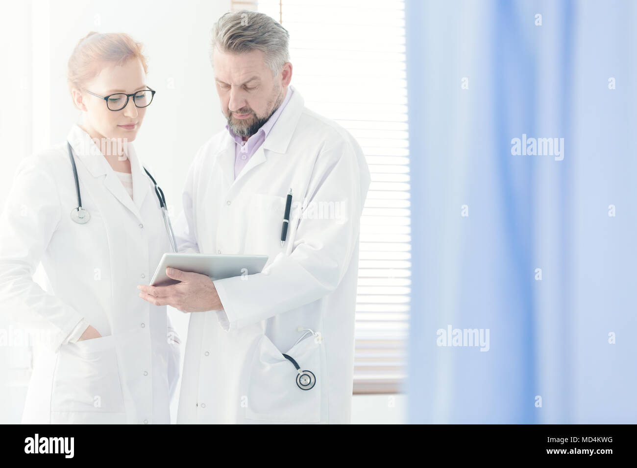 Concerned doctor patient consultation hi-res stock photography and ...