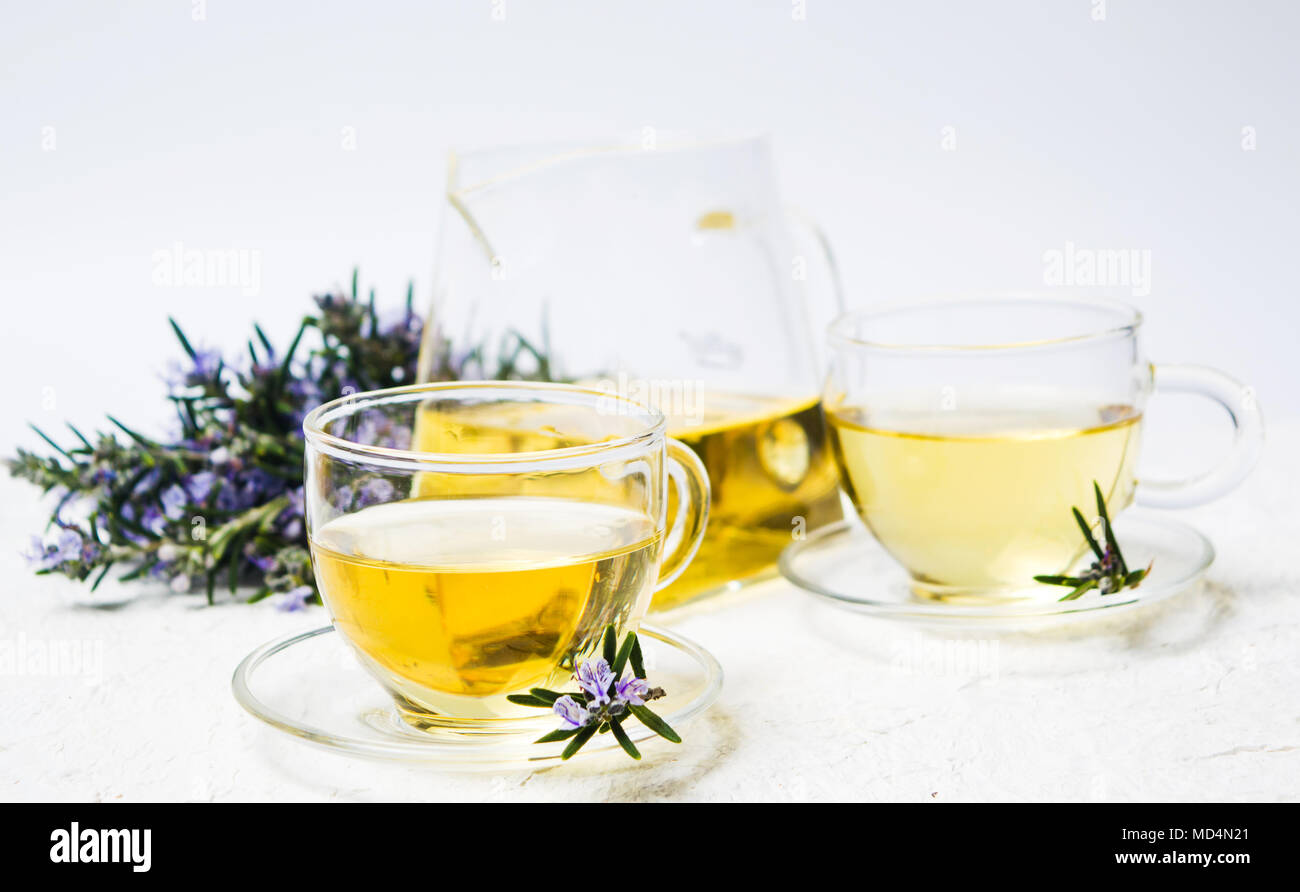 Rosemary tea with fresh plant and blossom top view Stock Photo - Alamy