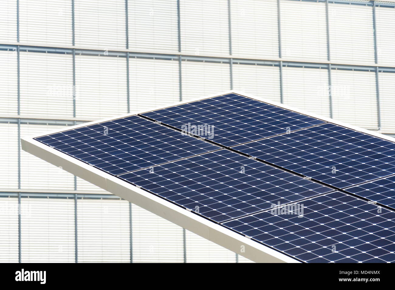 Blue rotating solar panels tilted axis tracker, future energy concept ...