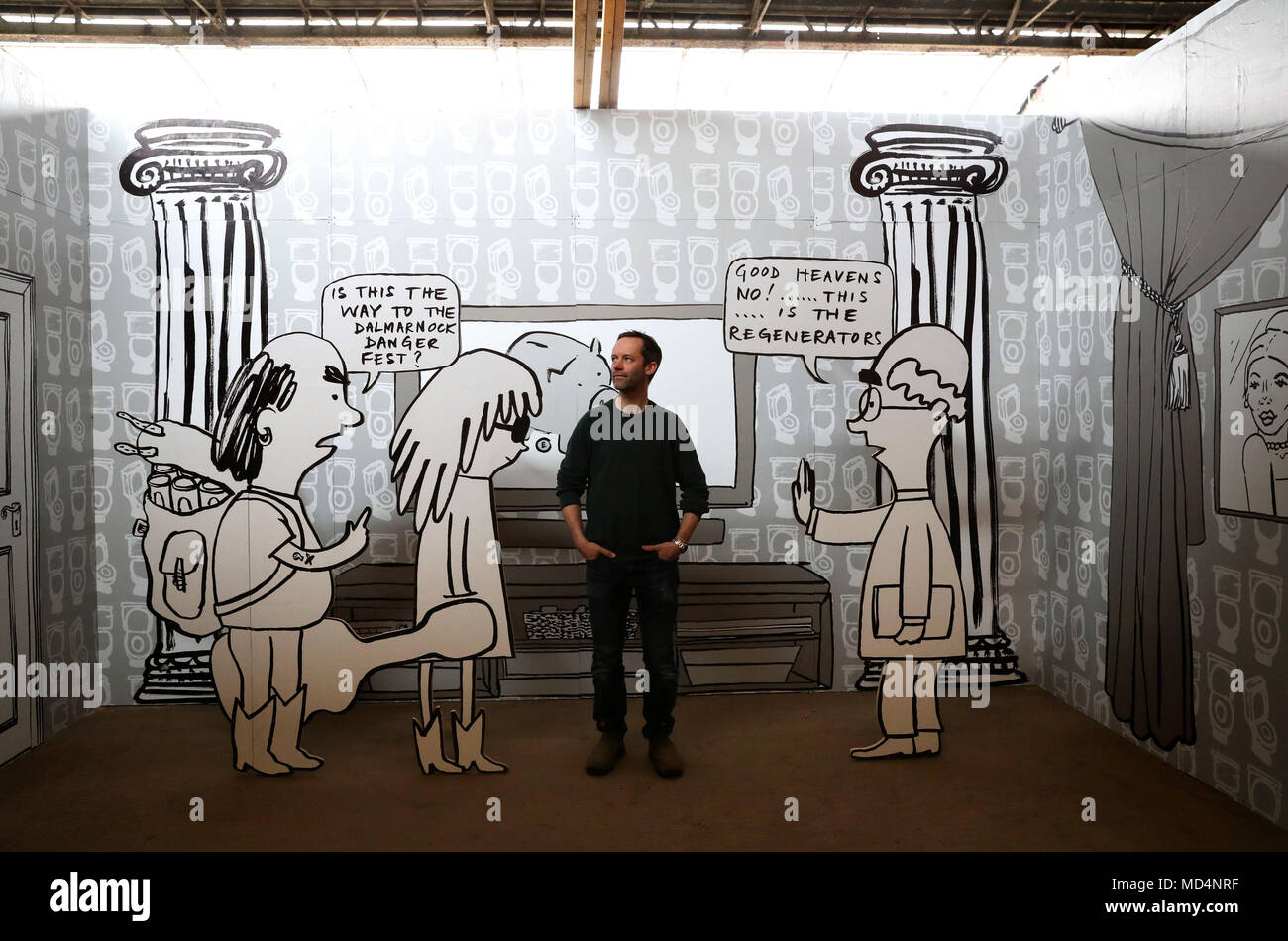 Artist Mick Peter stands in a room which is a view behind "Regenerators ...