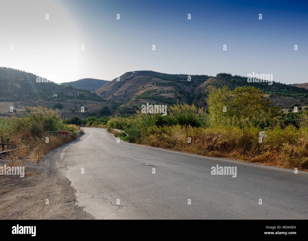 Road leading towards mountain landscape, Crete, Greece Stock Photo - Alamy