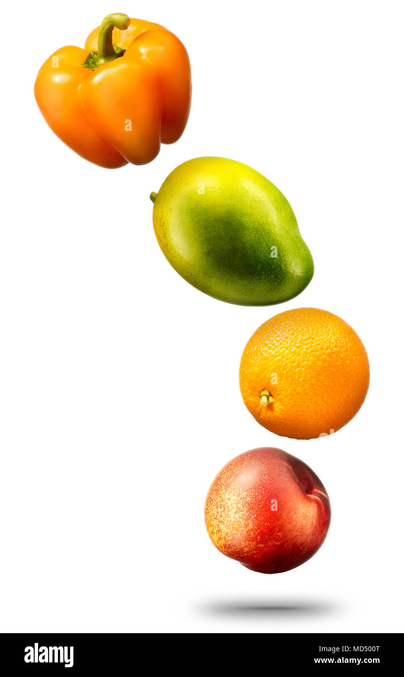 Falling fruits and vegetables isolated on white background with ...