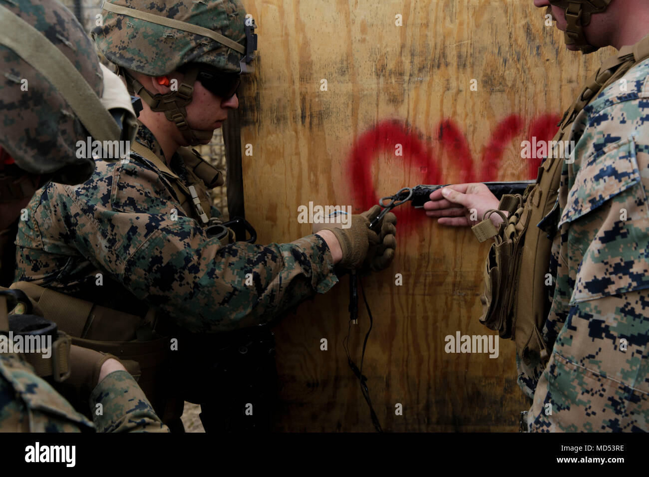 U.S. Marines from different units arm a breaching charge during an ...