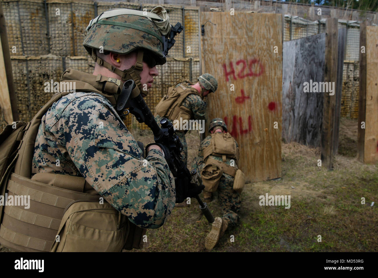 U.S. Marines from different units arm a breaching charge during an ...