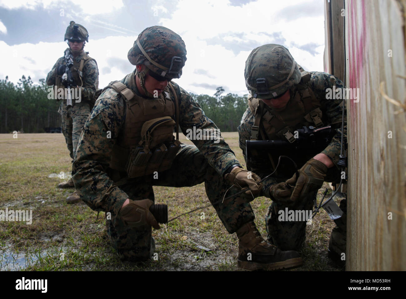 U.S. Marines from different units arm a breaching charge during an ...