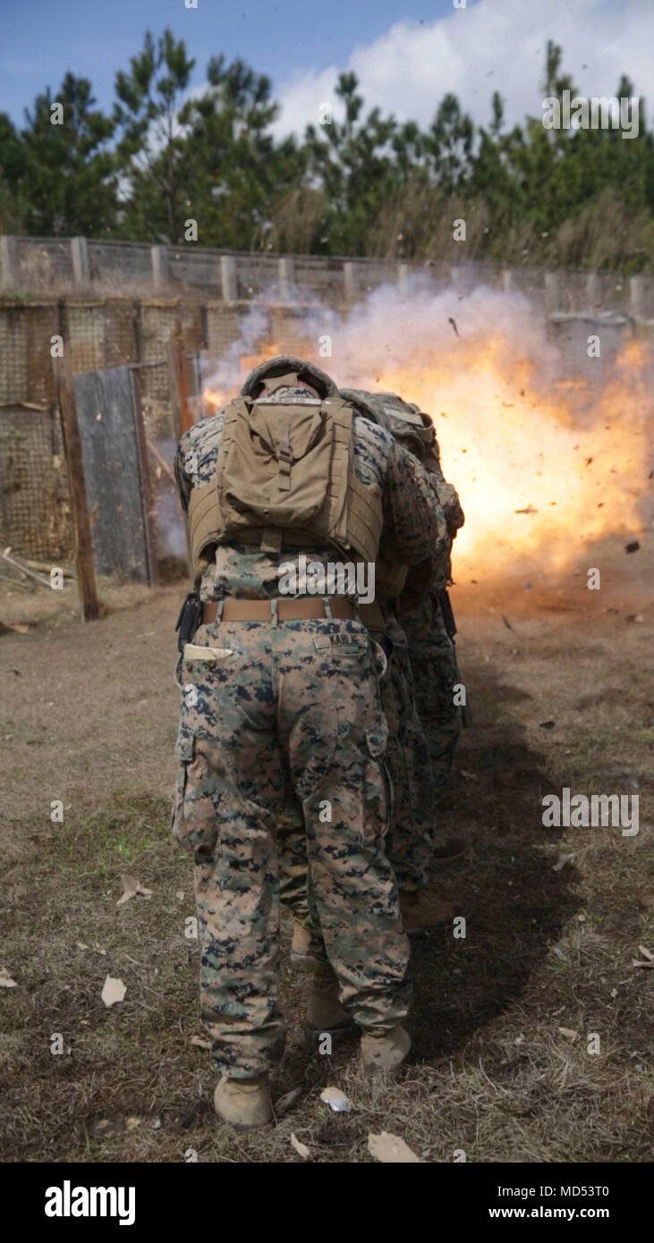 U.S. Marines from different units detonate an oval charge during an ...
