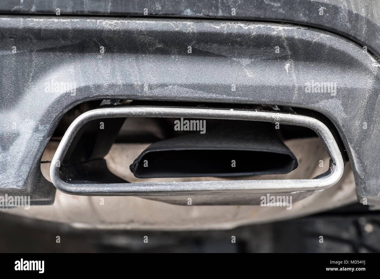 Close image of a car exhaust Stock Photo - Alamy