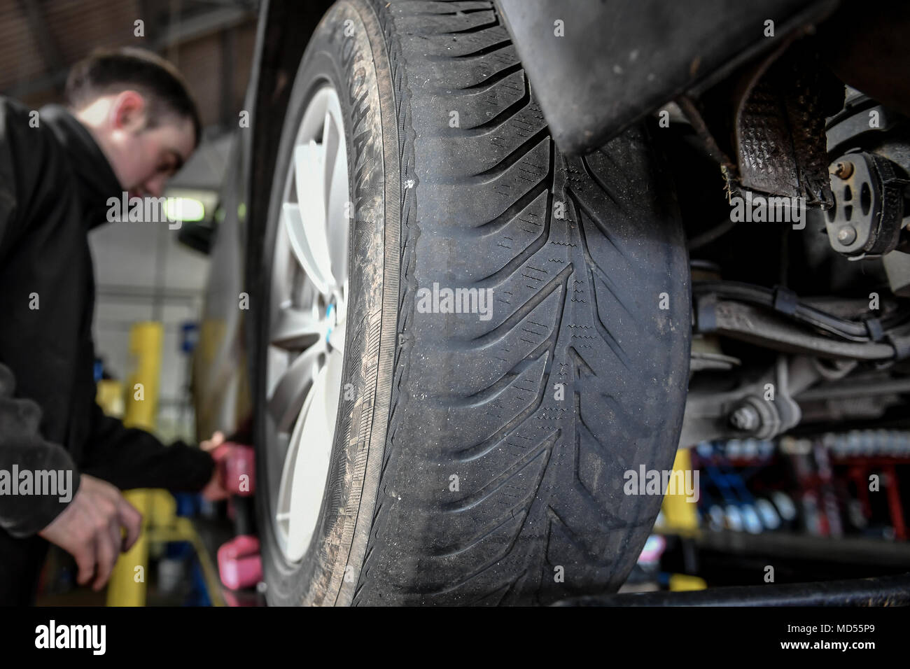 A car tyre is replaced in a garage Stock Photo - Alamy