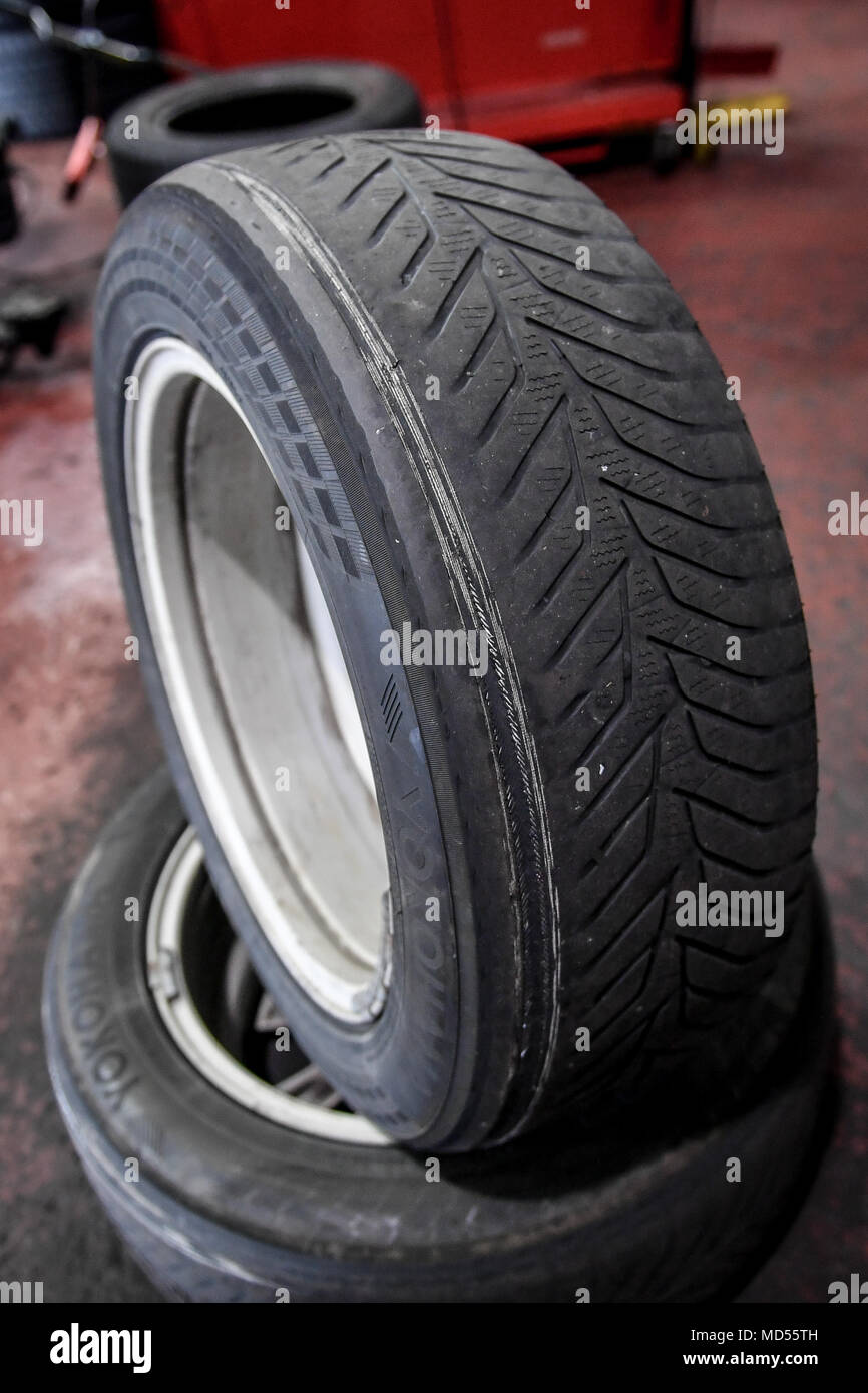 A car tyre on the floor of a garage Stock Photo - Alamy