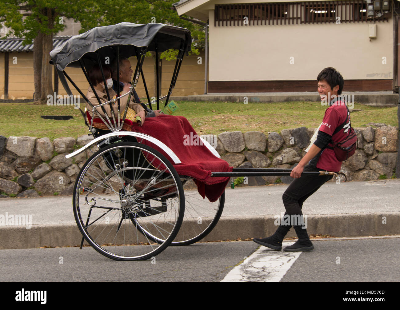 Rickshaw being pulled hi-res stock photography and images - Alamy