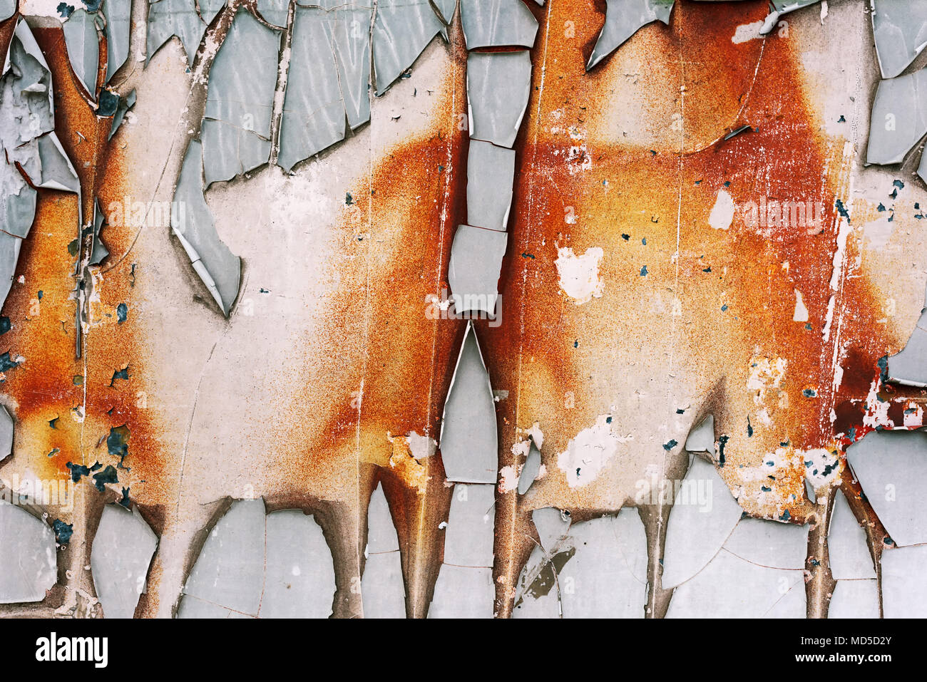 Abstract scratched texture of torn paper glued to a rusty metal surface ...