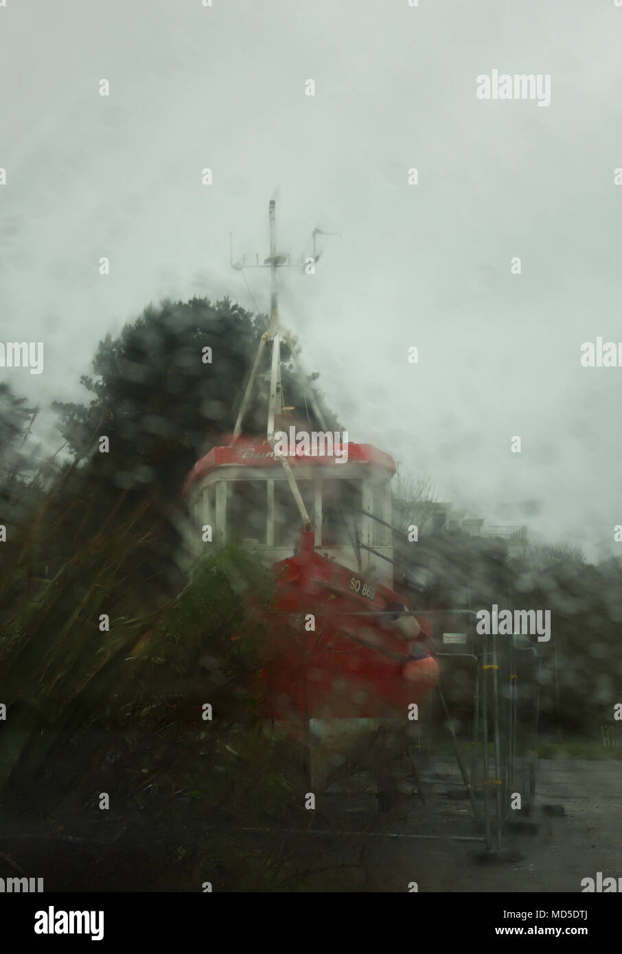 Boat in the rain Stock Photo - Alamy