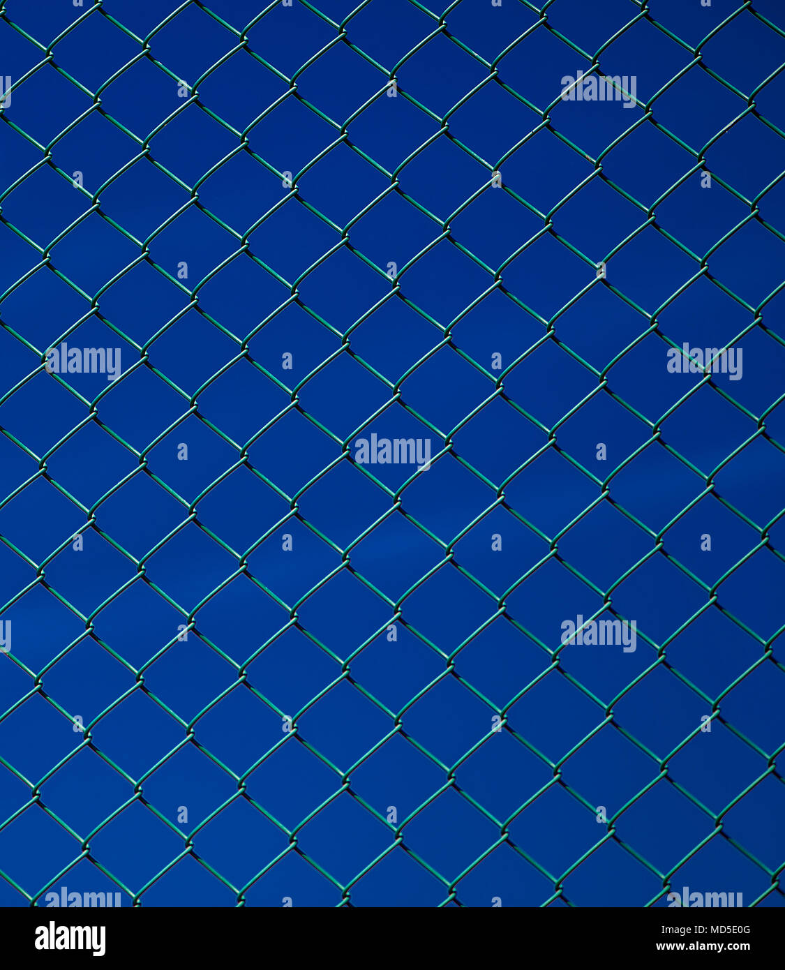 Chain Link Fence with a Blue Sky Background Stock Photo - Alamy