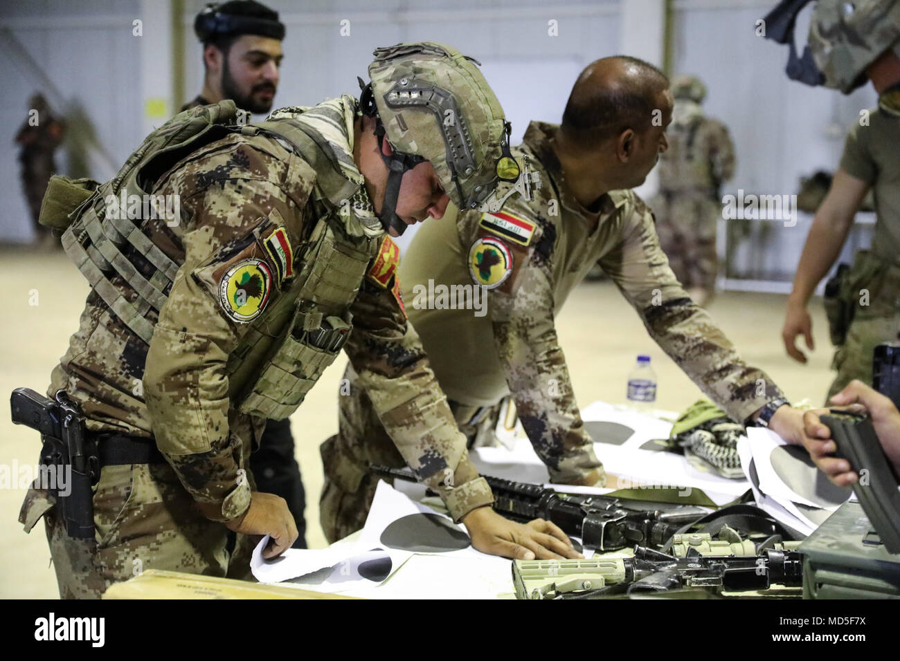 An Iraqi Counter Terrorist Forces soldier prepares targets for live ...