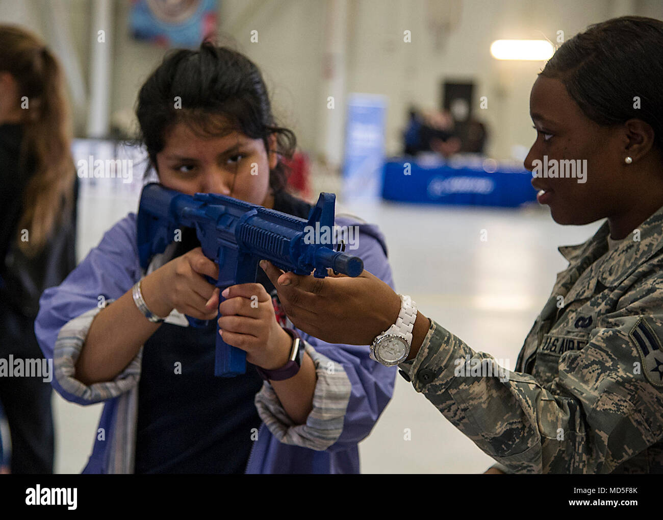 A1C Shaniyah Wrighton, 315th Security Forces Squadron, teaches a girl ...
