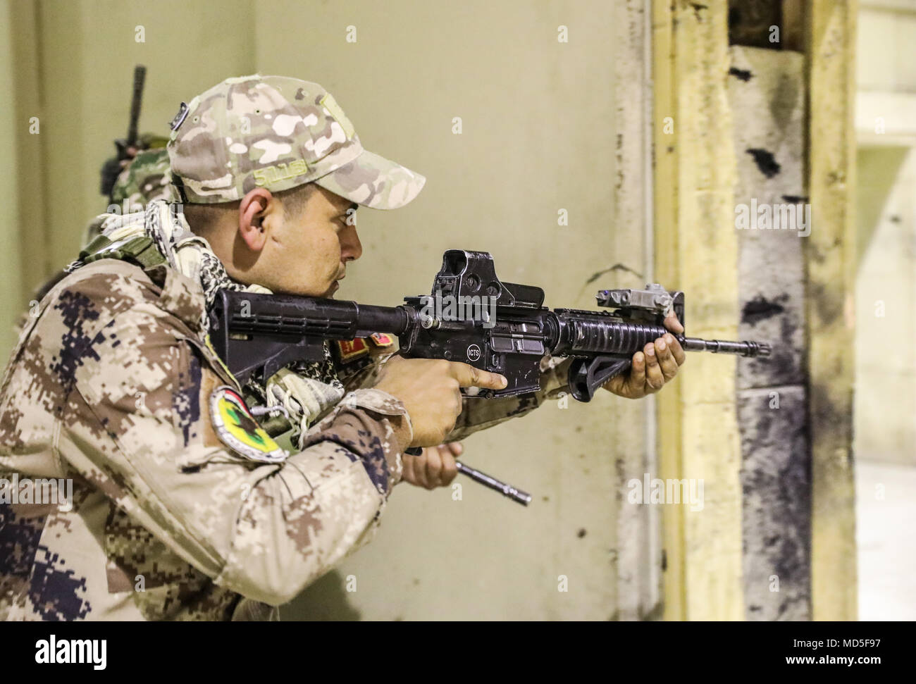 A soldier with the Iraqi Counter Terrorist Forces enters room in a dry ...