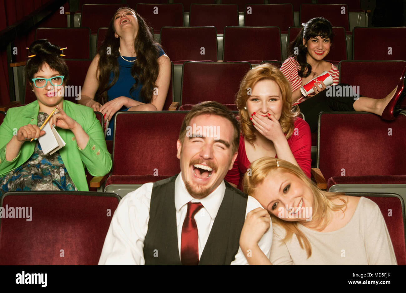 A group of people reacting to a movie Stock Photo - Alamy