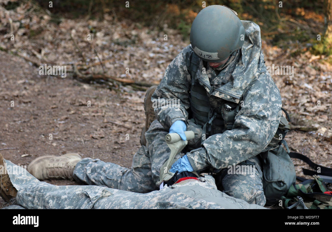 Sgt. Pattisue Graham, Medical Support Unit-Europe treats the wound of a ...