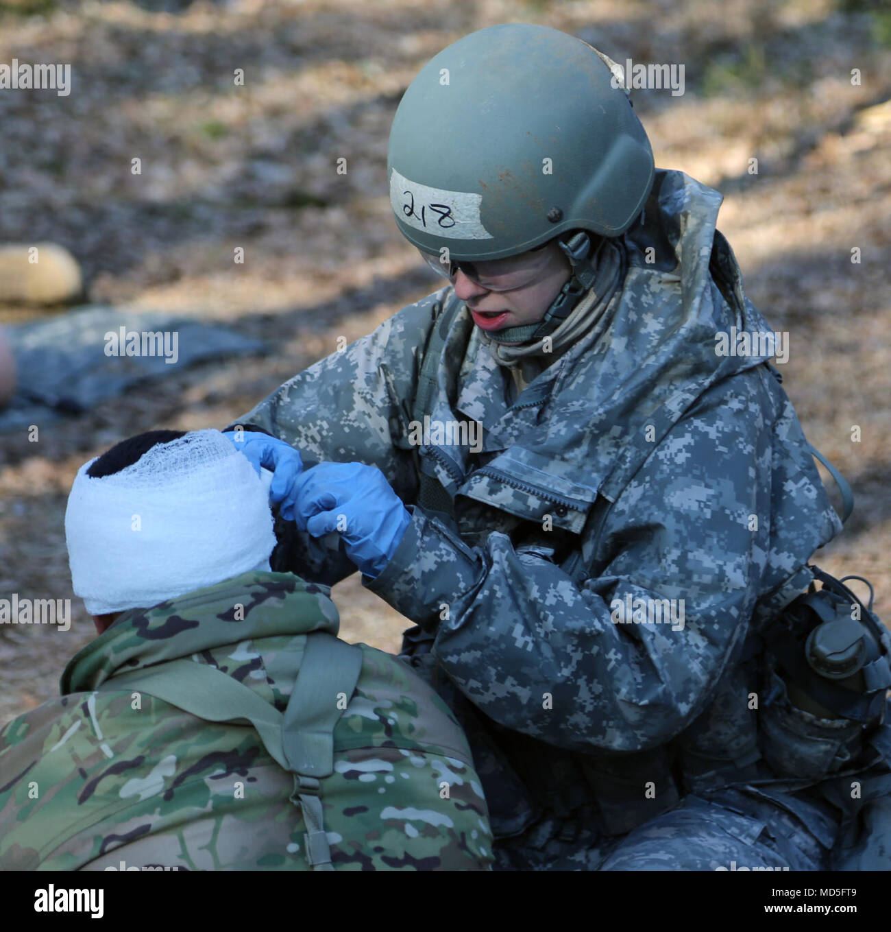 Sgt. Pattisue Graham, Medical Support Unit-Europe treats the wound of a ...