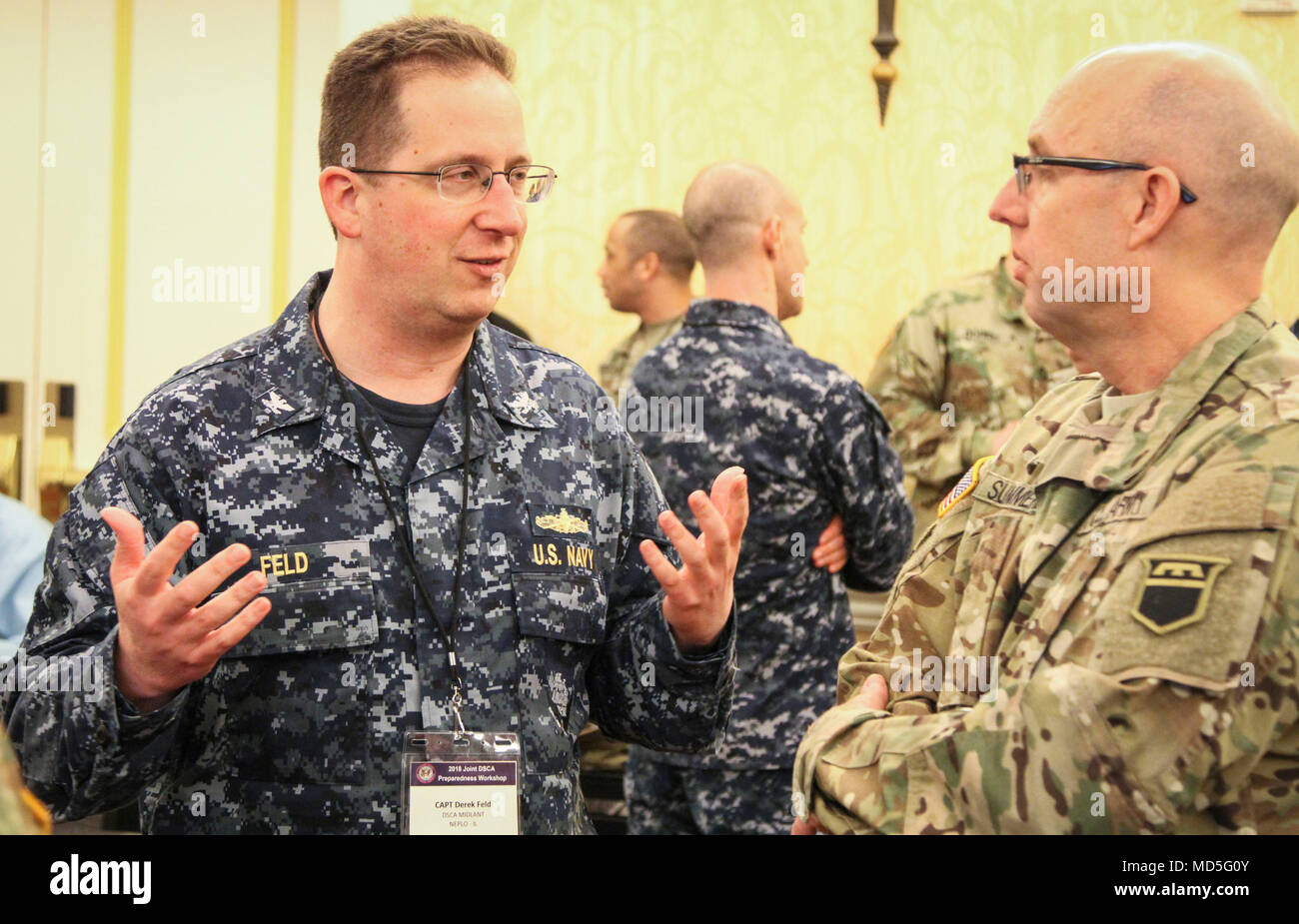 Navy Capt. Derek Feld (left), a naval Emergency Preparedness Liaison ...