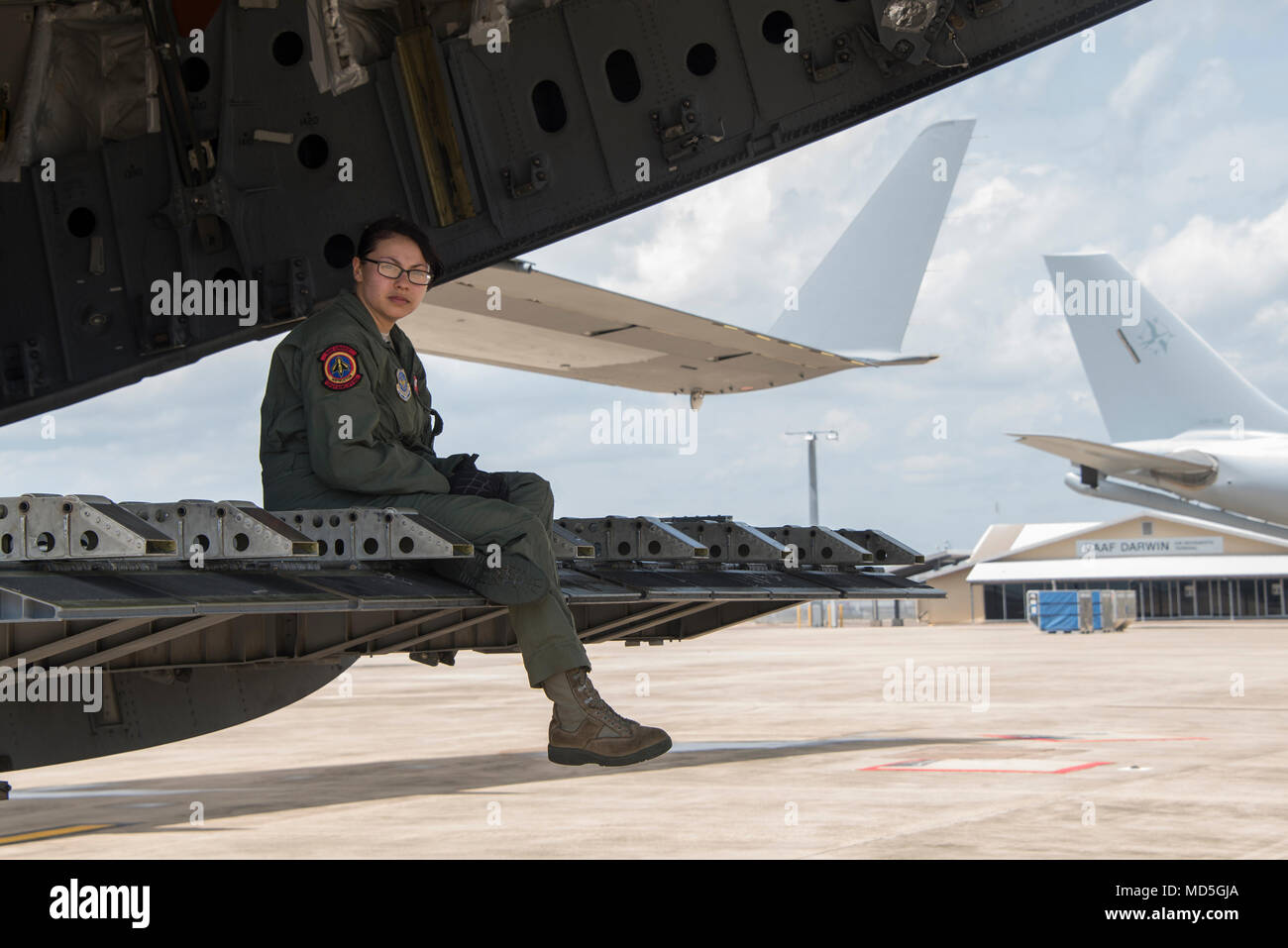 Staff Sgt. Ashley Cardillo, a loadmaster assigned to the 21st Airlift ...