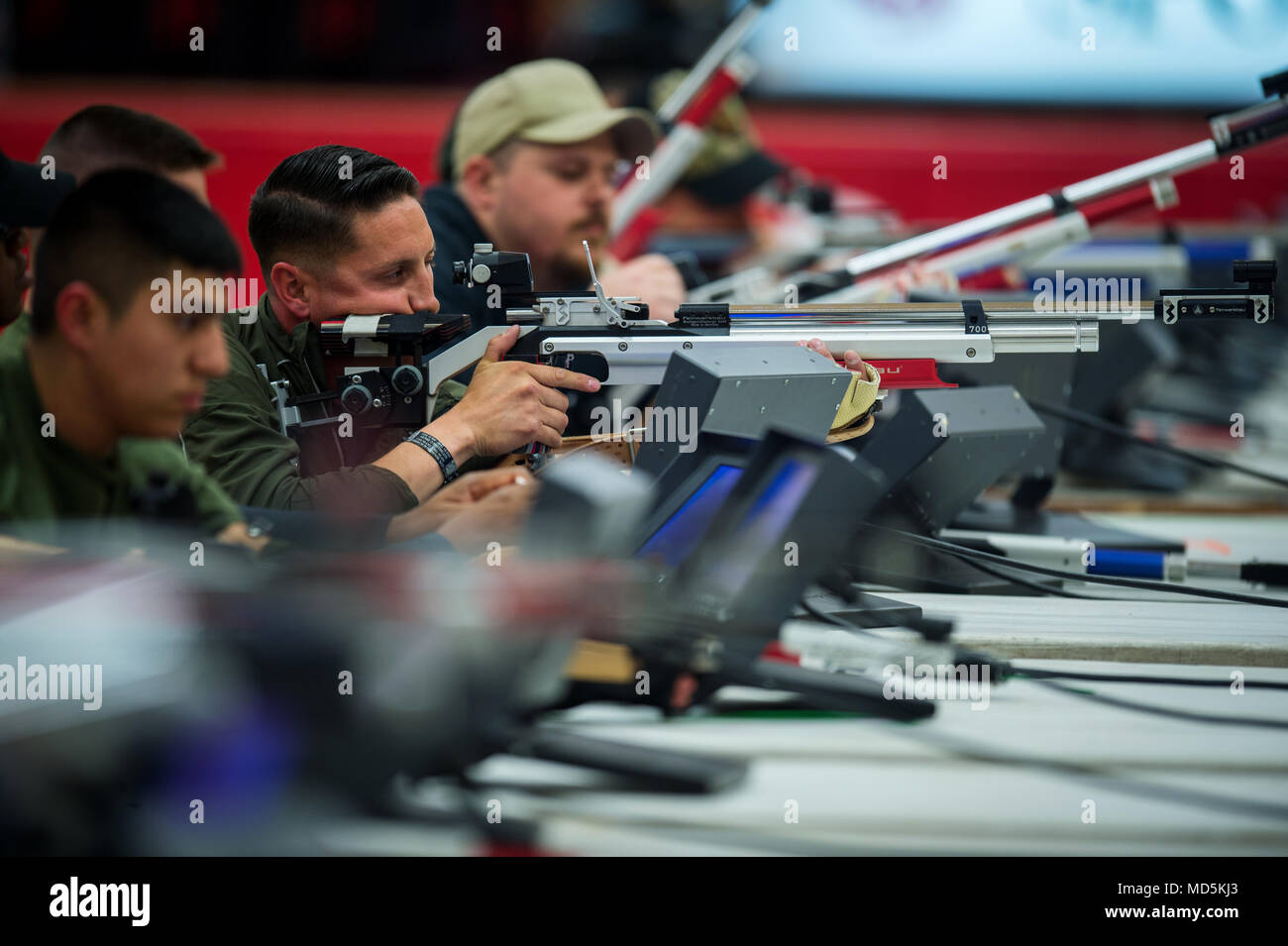 U.S. Marine Corps Staff Sgt. Jason Pacheco looks down the sight of his ...
