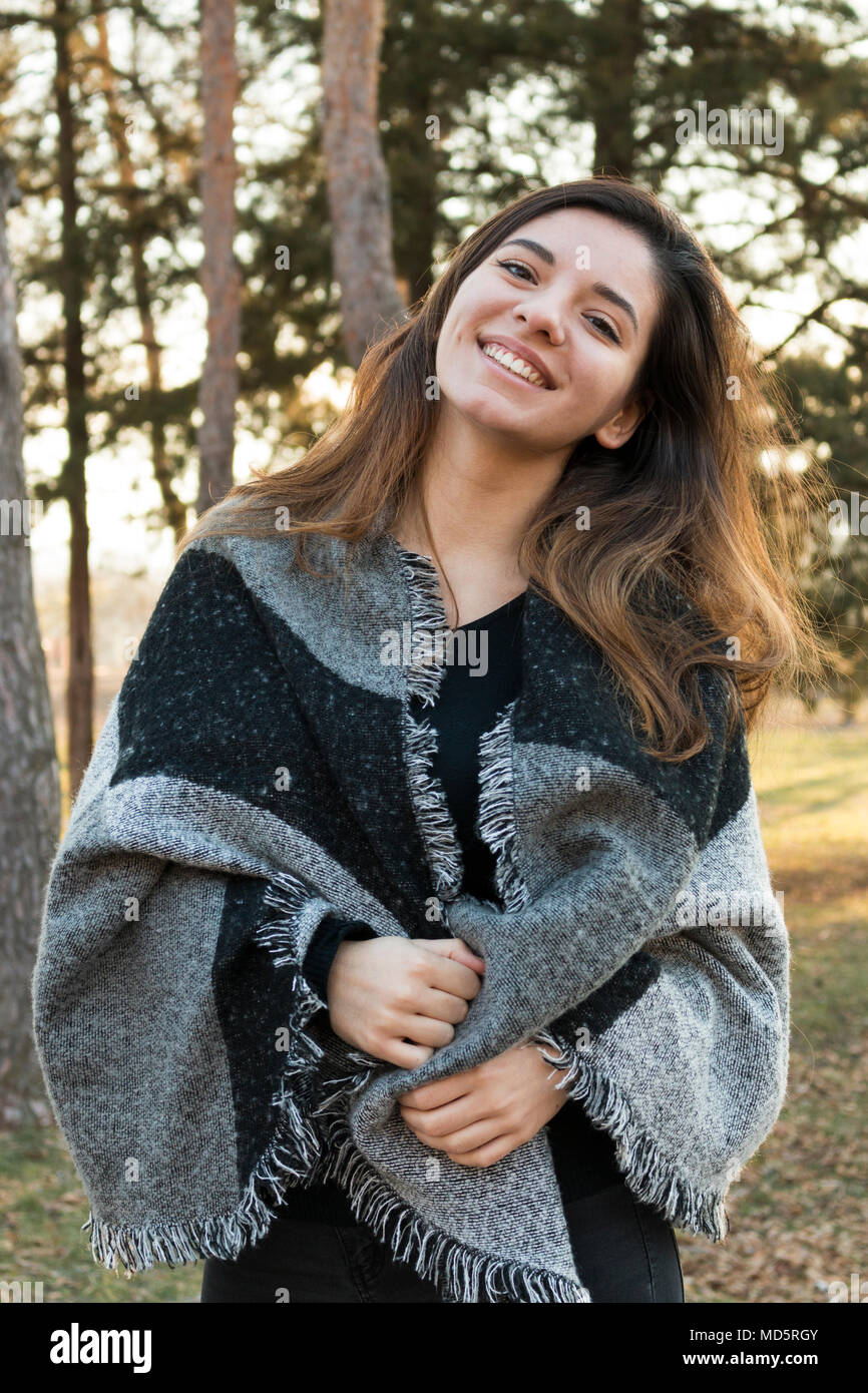 Svelte girl with scarf on smiling, sunset background Stock Photo - Alamy