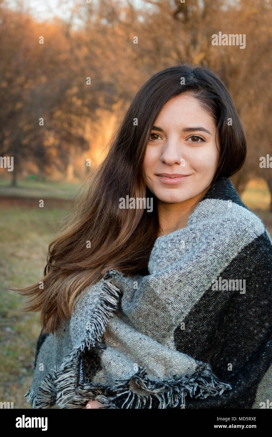 Svelte girl with scarf on smiling, sunset background Stock Photo - Alamy