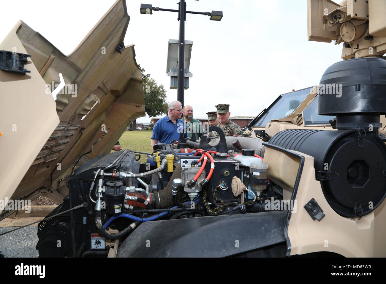 Marine Corps Logistics Command Marines and civilian-Marines look at an ...