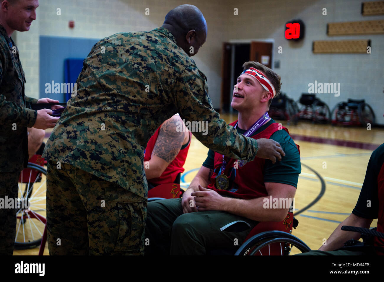 U.S. Marine Corps Staff Sgt. Justin Muhlhauser smiles as he is awarded ...