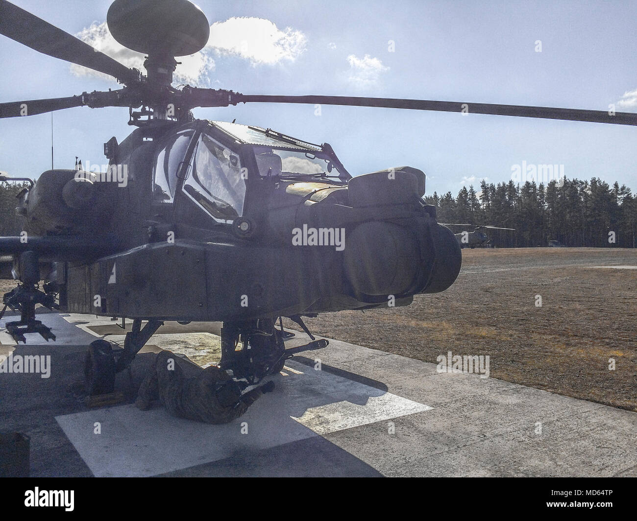 An ammunition specialist from the 12 CAB loads 30mm canon rounds into ...