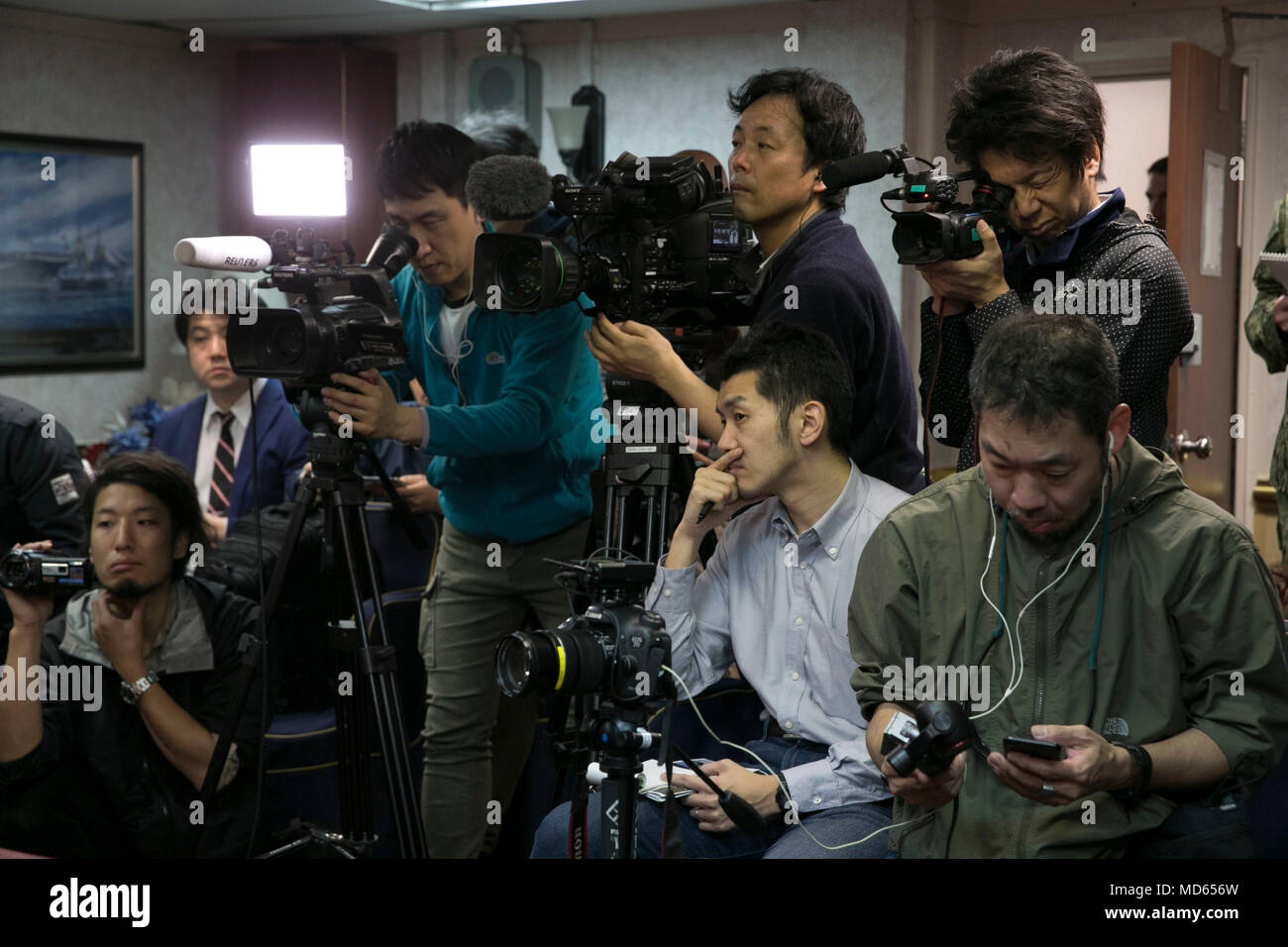 Reporters from various news agencies interview Capt. Colby Howard, the ...