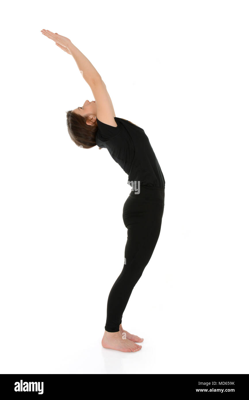 Young woman doing yoga asana Hasta Uttanasana, Raised Arms Pose ...