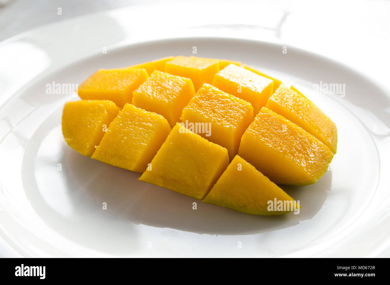 Mango cubes plate hi-res stock photography and images - Alamy