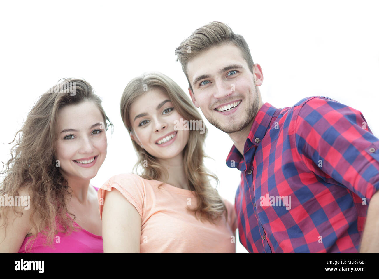 closeup of three young people smiling on white background Stock Photo ...