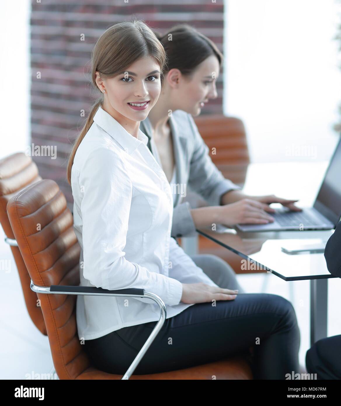office workers sitting behind a Desk Stock Photo - Alamy