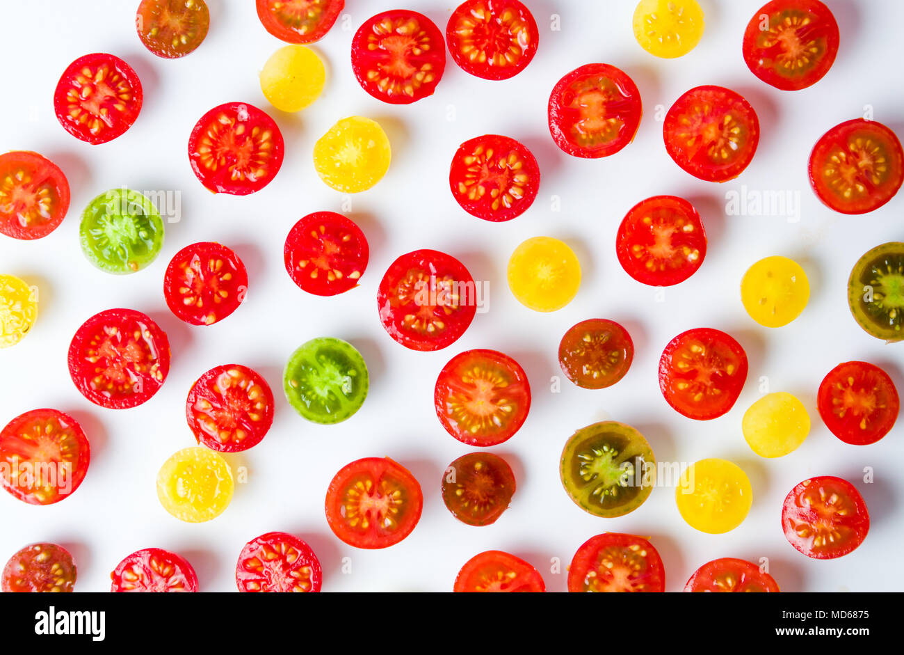 Sliced small cherry tomatoes background flat lay Stock Photo - Alamy
