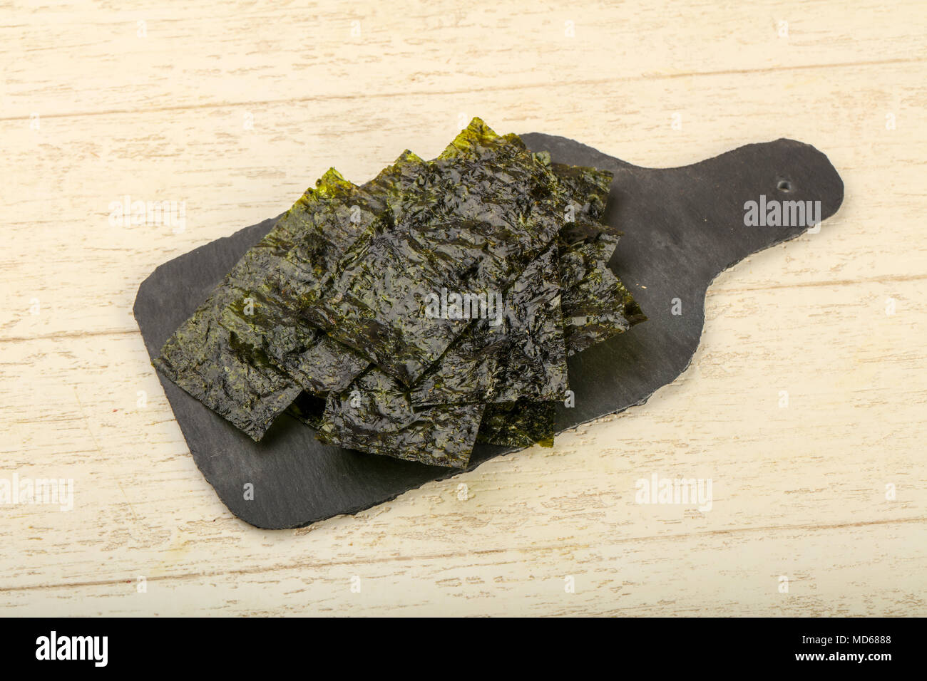 Crispy Nori sheets chips over wooden background Stock Photo - Alamy