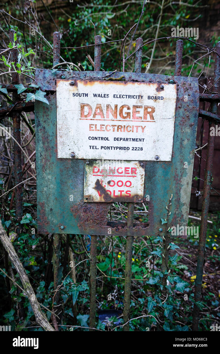 Rusting warning sign, South Wales Stock Photo - Alamy