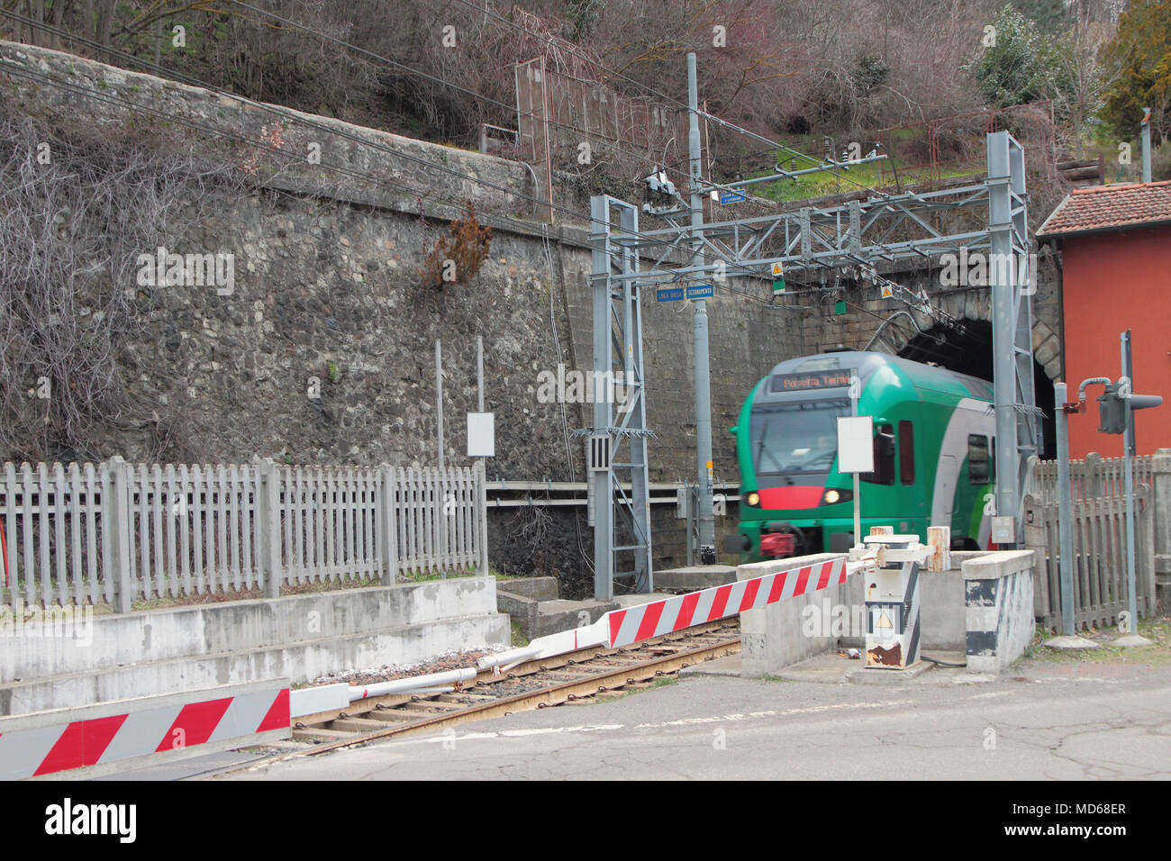 Closed railway crossing and train in tunnel. Riola, Bologna, Emilia ...