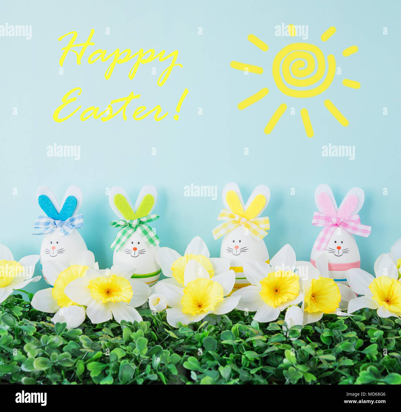 Several funny Easter bunnies with colorful bows made from Easter eggs ...