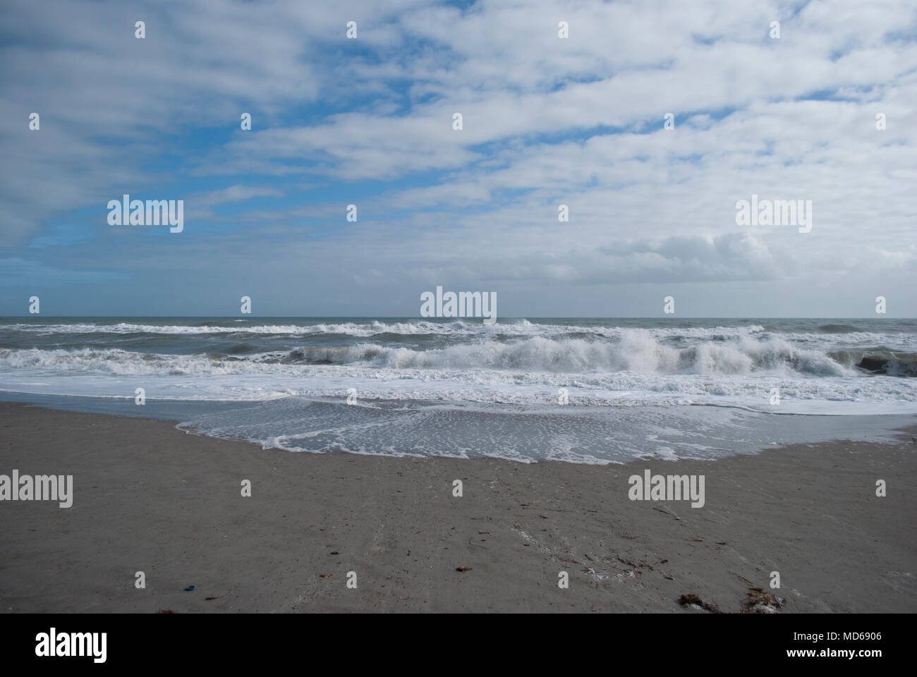 Ocean waves. Sandy beach. Steps on the sand at the beach. Backgrounds ...