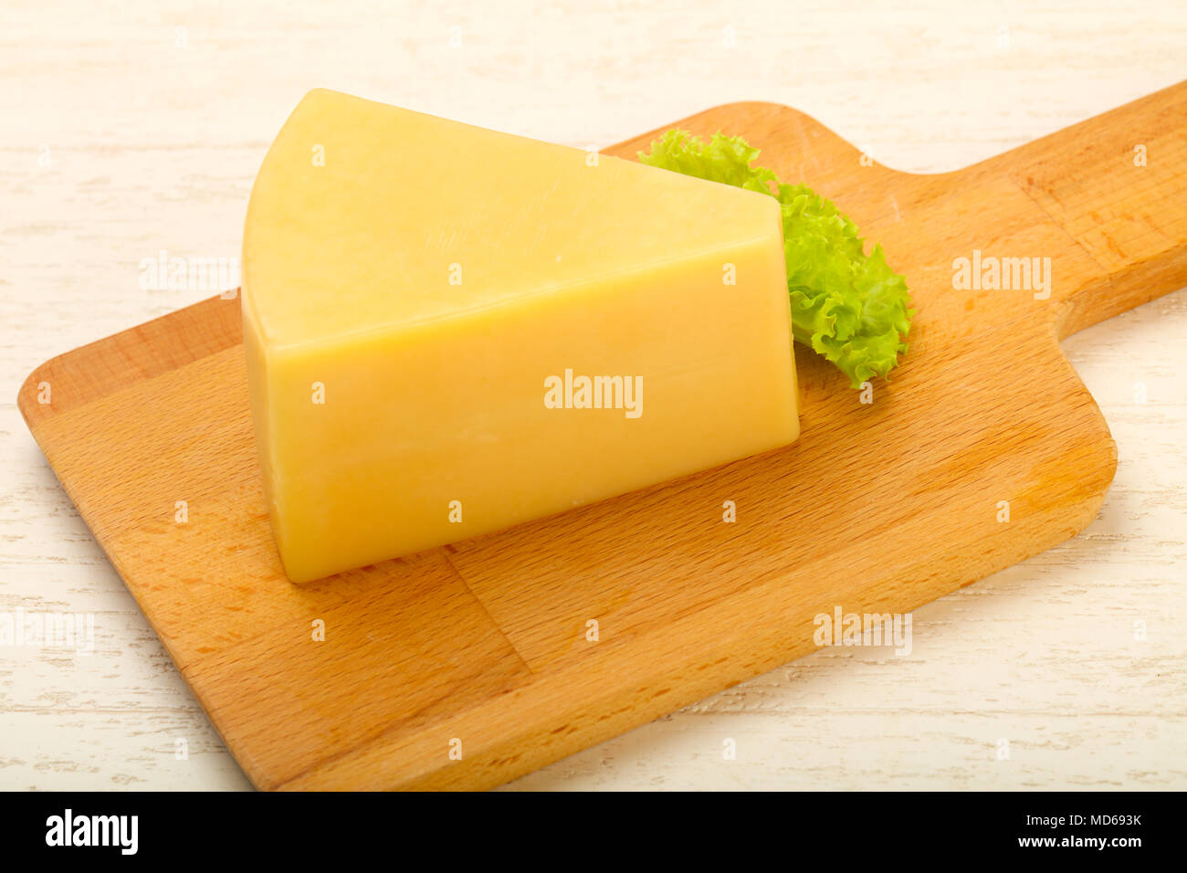Parmesan cheese triangle Stock Photo - Alamy
