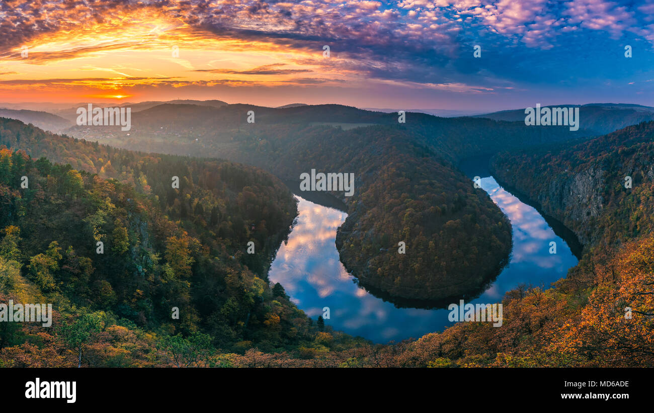 Panoramic view of river canyon with dark water and autumn colorful ...