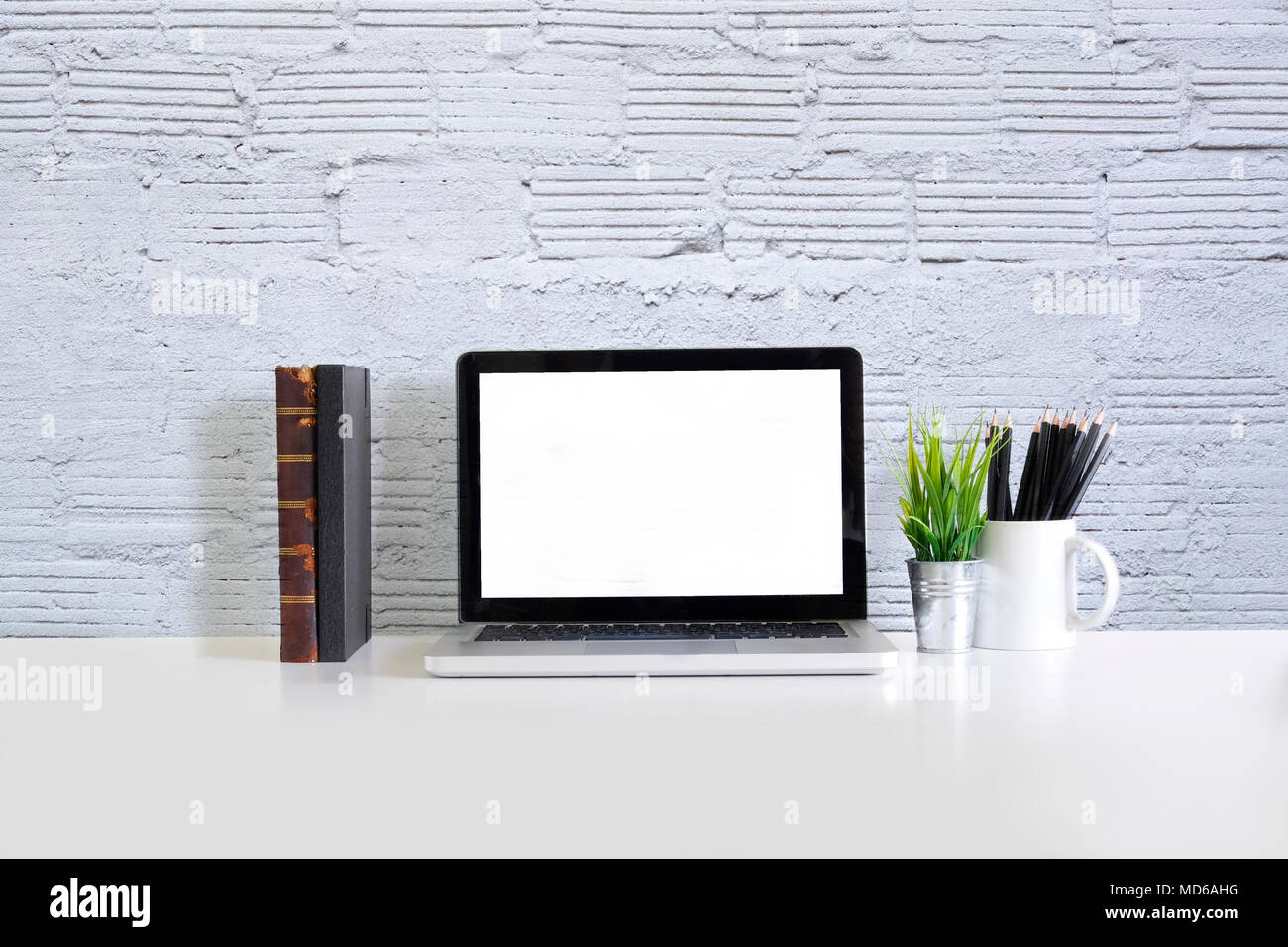 Modern workspace with laptop and book on office table Stock Photo - Alamy