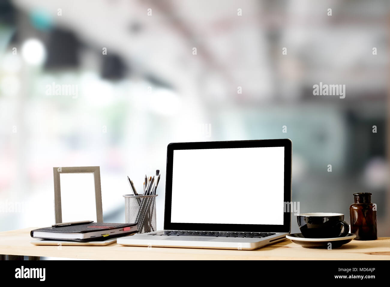 Workspace mockup with laptop computer and other office object on desk ...